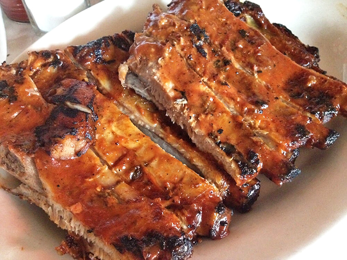 These ribs don't just fall off the bone &ndash; they practically leap into your mouth with a perfect marriage of smoke, meat, and tangy glaze.