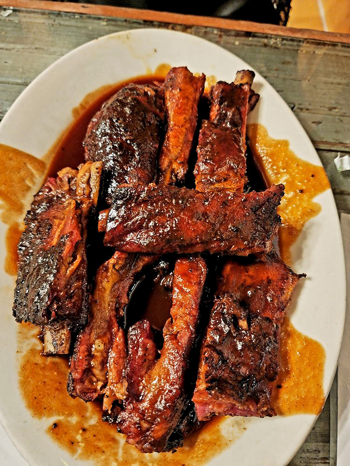 These ribs aren't just falling off the bone; they're practically writing love sonnets to your taste buds with that glistening sauce.