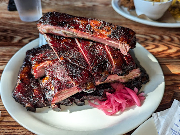These ribs don't just fall off the bone&mdash;they practically leap onto your fork with a perfect pink smoke ring and bark that means business.