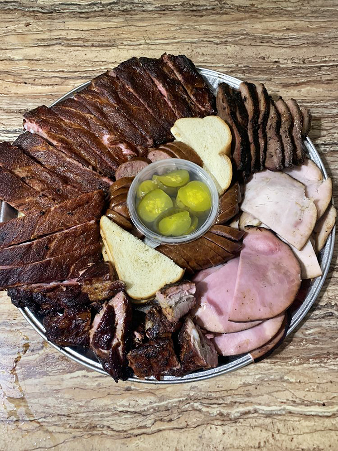 Behold the meat platter of dreams! That smoke ring isn't just for show &ndash; it's a pink badge of honor earned through hours of patient smoking.
