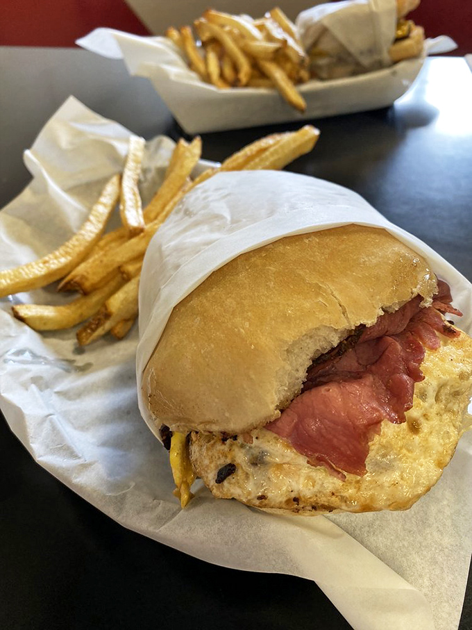 This isn't just a sandwich; it's a love letter to simplicity. Tender roast beef nestled in a fresh bun with curly fries standing guard&mdash;comfort defined. 