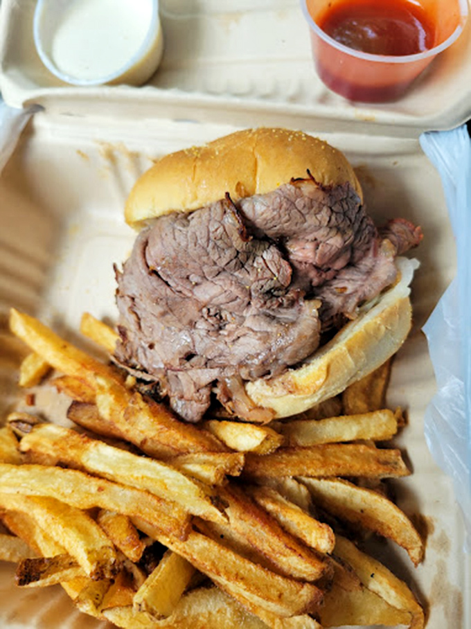 Behold the centerpiece of Maryland food culture! This mountain of thinly-sliced beef with golden fries is like a carnivore's lullaby.