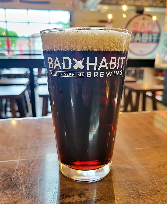 Dark as midnight with a creamy head that lingers like a good conversation. This isn't your average pint&mdash;it's a commitment to excellence.