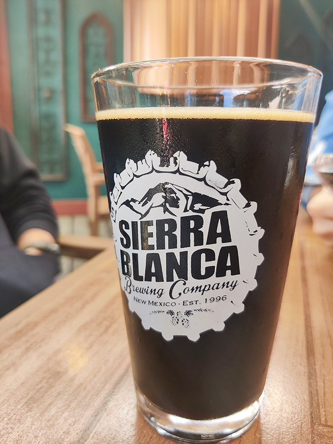 Liquid obsidian in a glass. Sierra Blanca's dark brew gleams with promise, topped with a perfect head that's practically begging for your first sip.