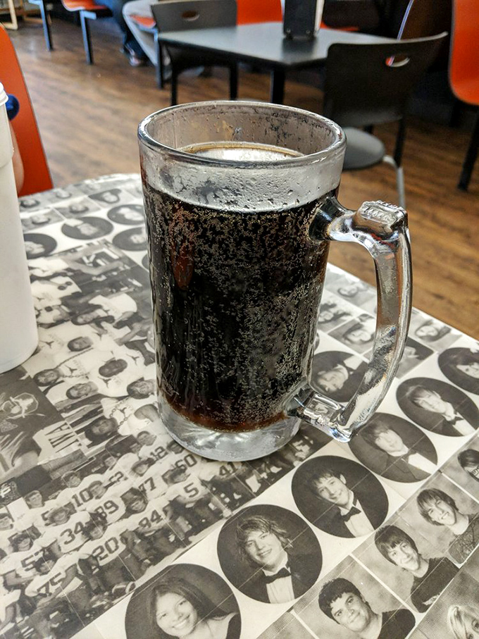 Like meeting an old friend who's aged beautifully, this frosty mug of house-made root beer sits atop memories preserved in yearbook photos.