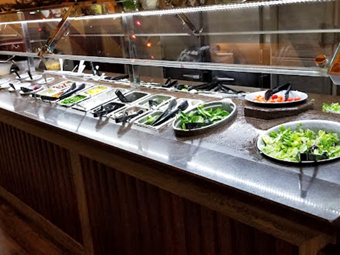 The salad bar—that magnificent first line of defense against buffet regret. "I'll start healthy," you lie to yourself before the real damage begins.