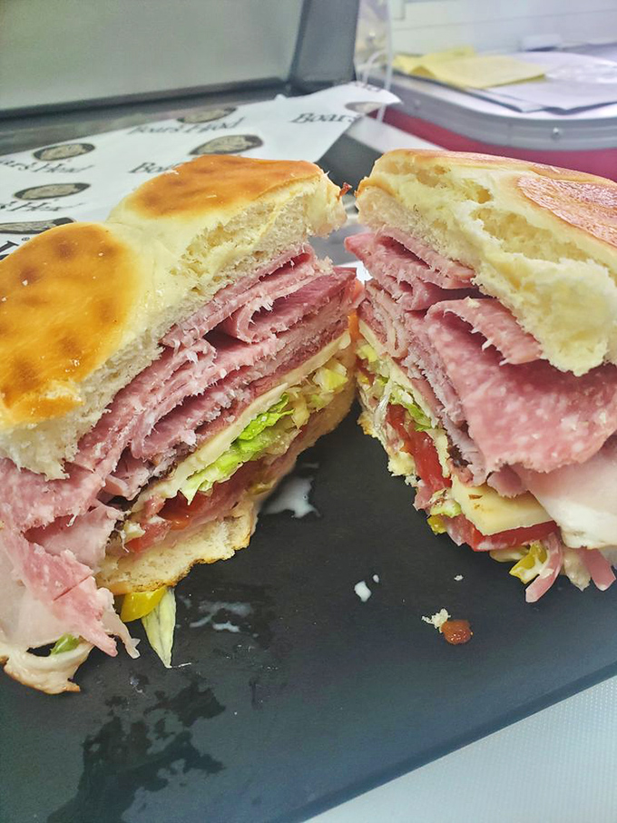 This isn't just a sandwich; it's an architectural marvel where layers of ham, cheese, and fresh vegetables create the skyscraper of lunch dreams.