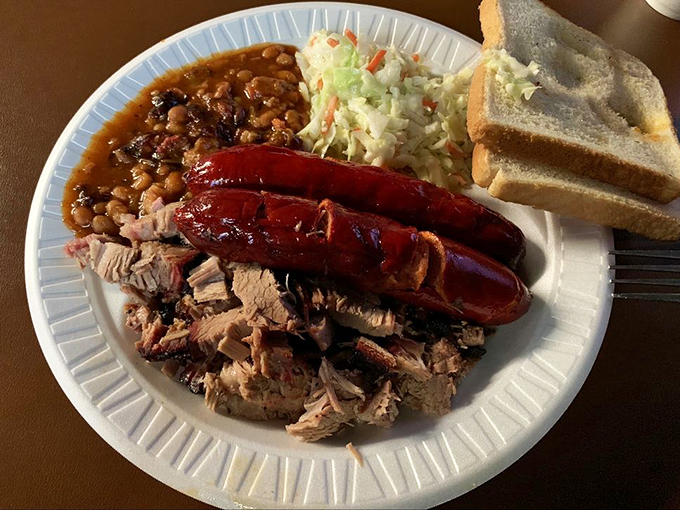 Smoke rings don't lie. These hot links and pulled pork share a plate with sides that know their supporting role in this meaty masterpiece.