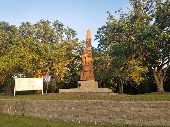 This towering wooden sculpture watches over Ocean Springs like a guardian of coastal culture, catching golden hour light perfectly.