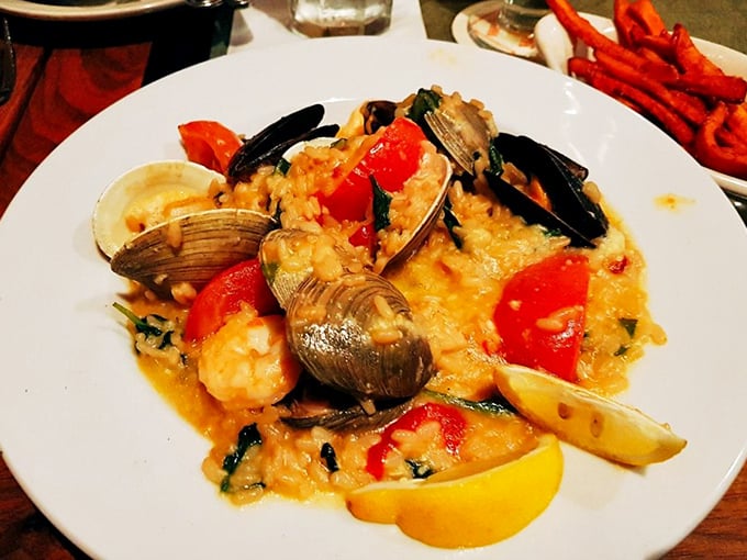 Snow crab legs reaching skyward like they're making one last dramatic bid for freedom. The potatoes wisely stay neutral in this delicious drama. 