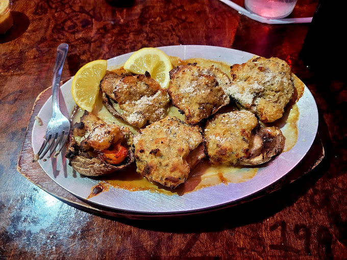 Golden-brown treasures from the sea nestled on a plate like edible jewelry, each oyster a perfect bite of coastal bliss.