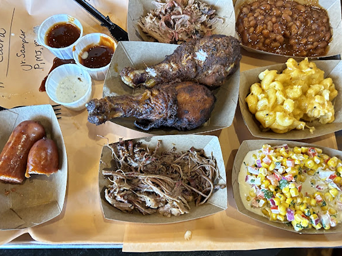 BBQ heaven arrives on a tray: pulled pork, chicken, sausage, and sides that make you question why you ever ate anything else. 