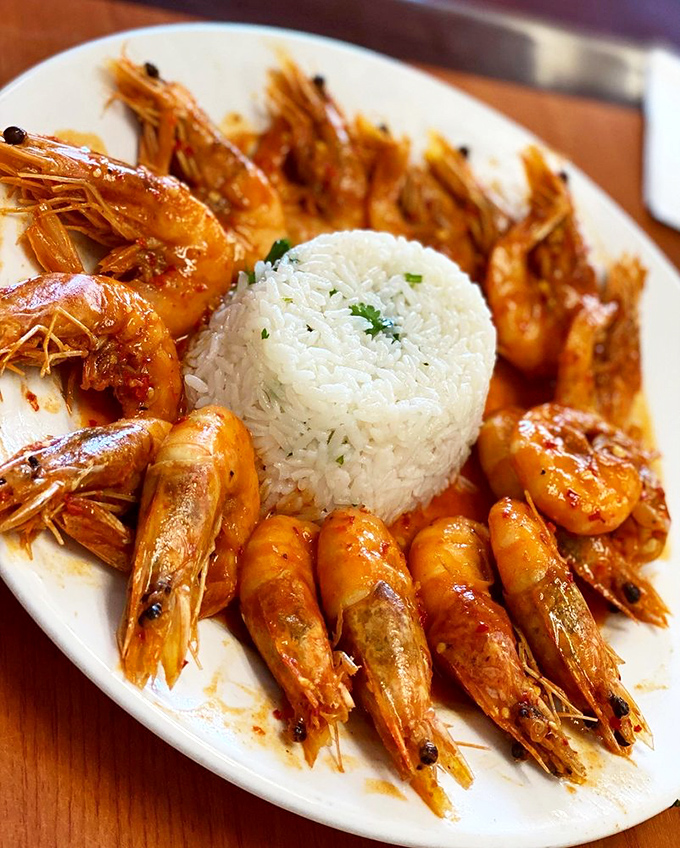 Perfectly cooked shrimp encircle a mountain of rice like synchronized swimmers around a pool. Simple presentation that lets the quality speak volumes.