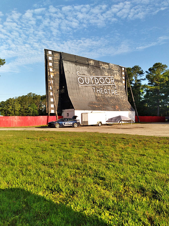 The massive projection screen awaits dusk's arrival, when everyday cars become personal viewing lounges under Carolina stars.