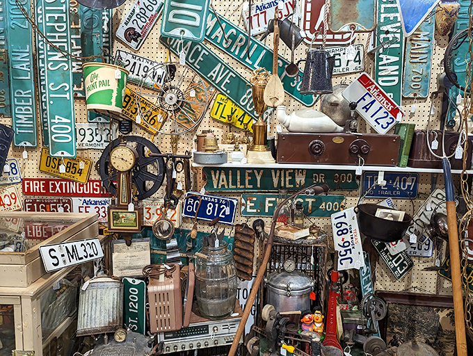 Street signs and memorabilia create a chaotic tapestry of Americana. It's like someone raided the prop department of every historical film ever made.