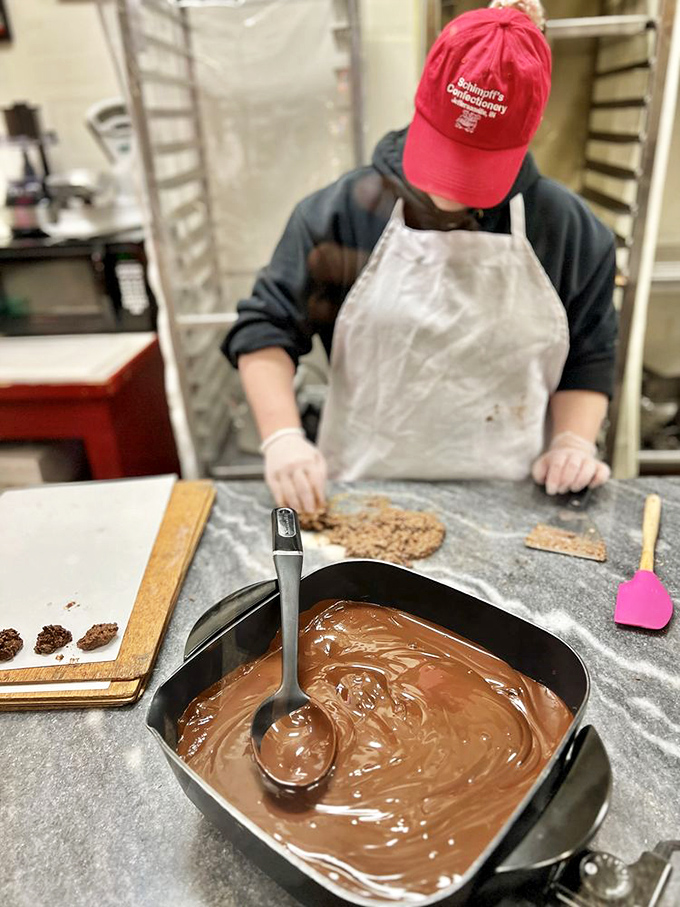 Behind every great candy shop is a team in red aprons, guardians of sugar traditions older than your grandparents' first date.