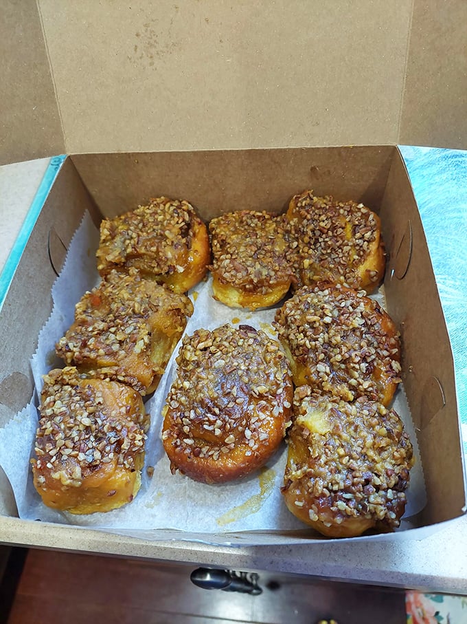 These sticky buns aren't just breakfast, they're an event—golden spirals of dough crowned with caramelized nuts that make morning people out of night owls.