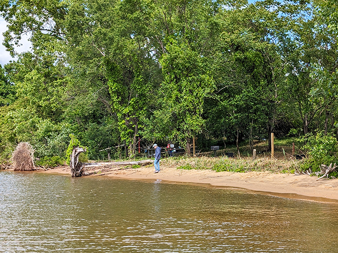 Weekend explorers stake their claim on this hidden shoreline, proving that sometimes the best adventures require getting your feet wet.