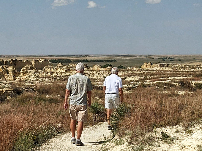 Two adventurers follow the trail where dinosaurs once roamed, proving that the best conversations happen when surrounded by millions of years of geological storytelling.
