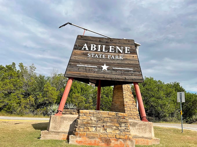 Abilene State Park: Historic craftsmanship meets Texas landscape at this rustic entrance, where Depression-era stonework still welcomes weary travelers.