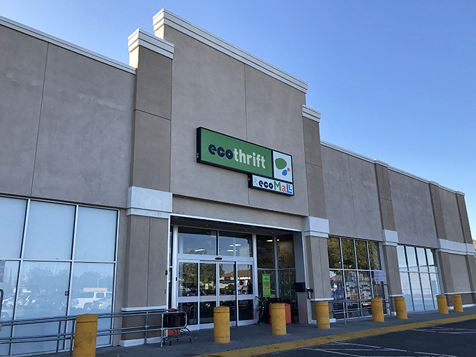 Eco Thrift's unassuming facade hides a labyrinth of potential treasures. The green sign whispers "sustainable shopping" to passersby.