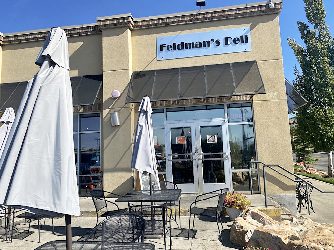 Feldman's outdoor patio waits patiently for you to emerge with a sandwich that requires both hands and possibly a building permit.