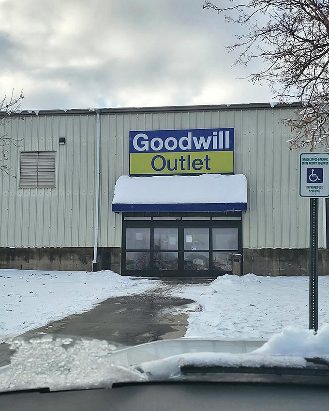 Winter can't stop the bargain hunters! Goodwill's outlet stands ready, a snow-dusted fortress of fantastic finds waiting to be discovered.