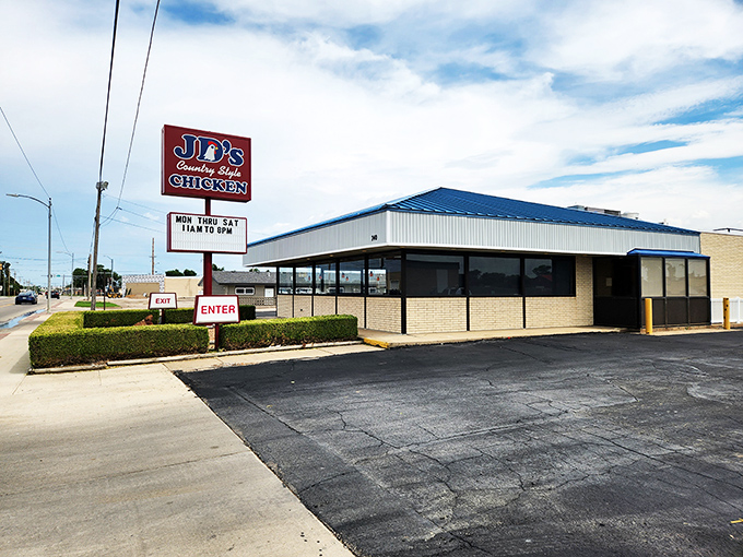 JD's bright blue roof and bold sign make a promise that the chicken inside will be anything but ordinary.