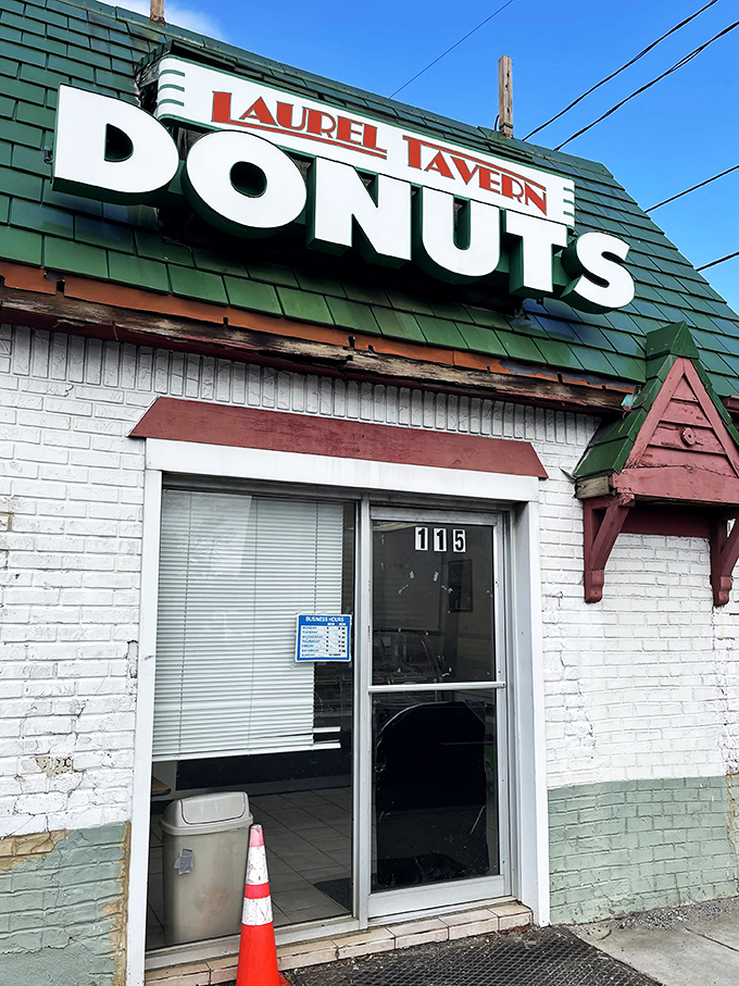 The iconic green-roofed Laurel Tavern Donuts &ndash; where timeless signage promises exactly what you'll get: donuts worthy of pilgrimage status.