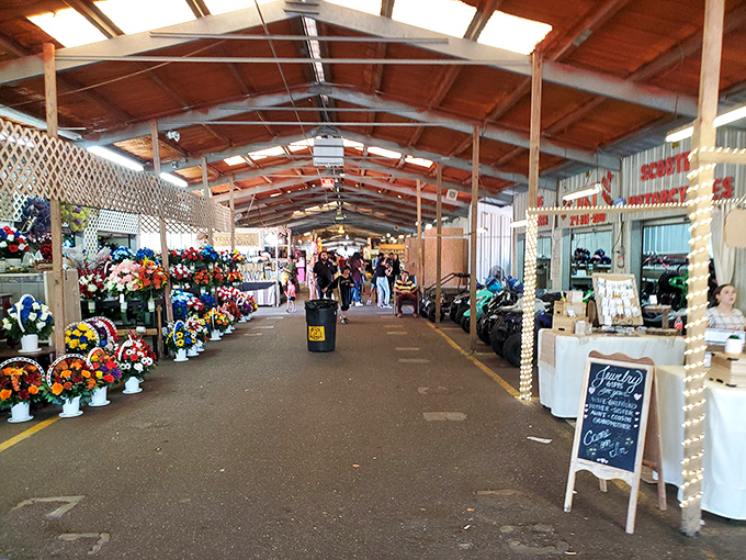 The Mobile Flea Market's covered walkways offer a climate-controlled treasure hunt where floral arrangements bloom alongside vintage finds.