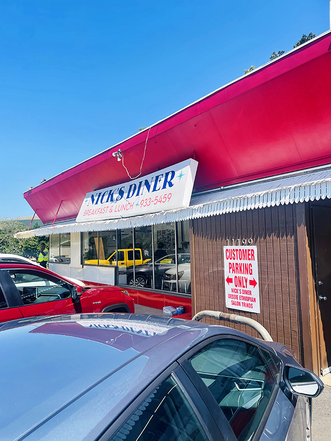 Nick's bright pink roof stands out like a flamingo at a penguin convention—impossible to miss and worth every calorie inside.