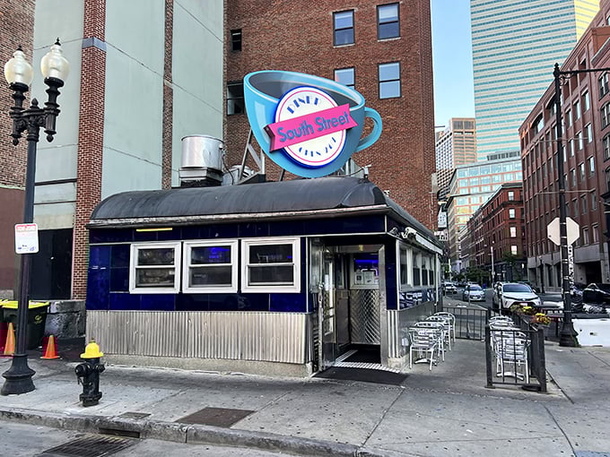 South Street's iconic coffee cup sign might be the most honest advertising in Boston—they really do serve a cup worth staying up for!