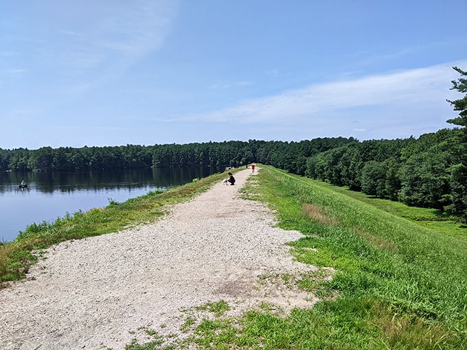 Water reflects the sky like nature's mirror at Ashland State Park, where the reservoir path offers peaceful escapes from daily chaos.