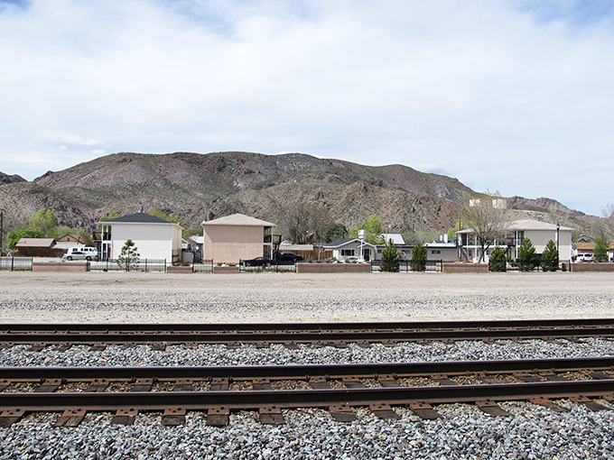 The railroad town of Caliente nestles between rugged hills, where train tracks still tell stories of Nevada's transportation history.
