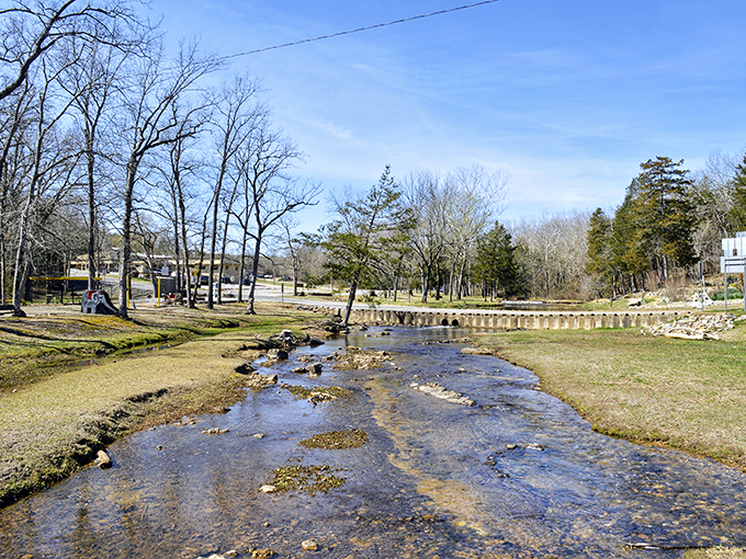 Sunlight dances across Cherokee Village's peaceful lake &ndash; retirement paradise without requiring your children's inheritance.