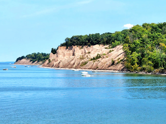 These dramatic bluffs have been slowly carved by wind and waves, proving Mother Nature's patience creates the most spectacular art.