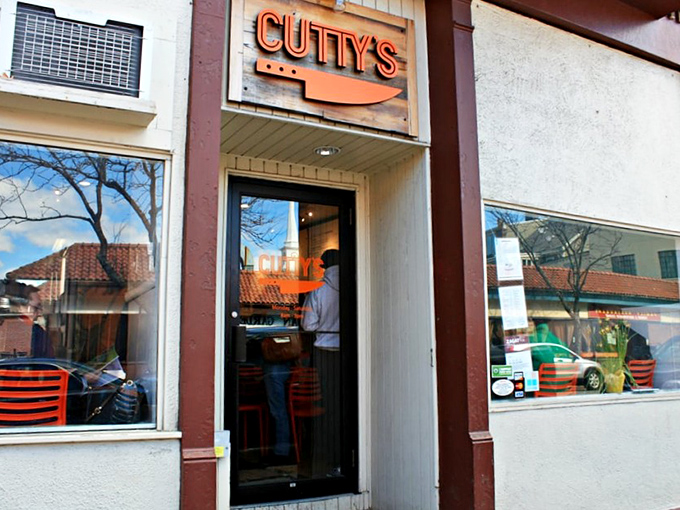The unassuming entrance to Cutty's belies the culinary revolution happening within &ndash; proof that greatness often comes in modest packages.
