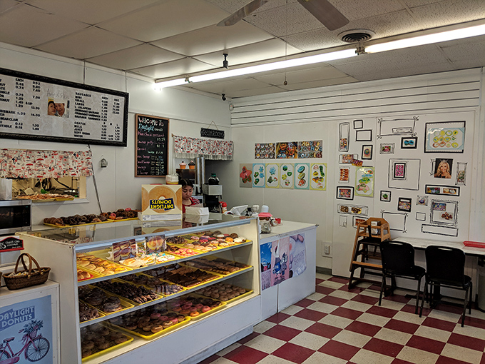 Where donuts line up like sugary soldiers ready for duty. This display case is the front line in the battle against boring breakfasts.