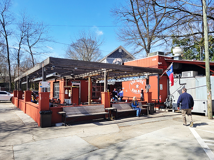 Winter trees frame Daddy D'z vibrant facade – a splash of barbecue color that stands out like sauce on a white shirt.