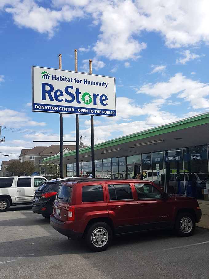 ReStore's bright signage beckons under clear blue skies. Where cabinet doors and light fixtures go for their second act!