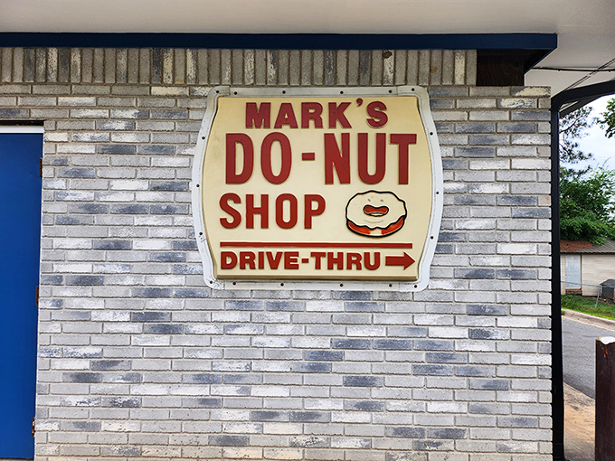 The gray brick exterior might not win architectural awards, but the donuts inside deserve their own Food Network special.