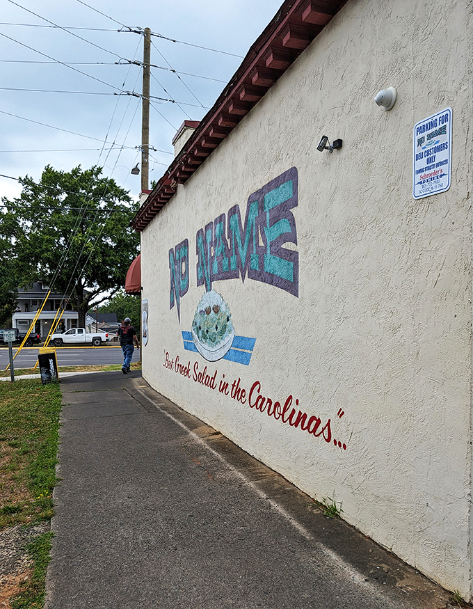"Best Greek Salad in the Carolinas" isn't just wall art—it's a promise delivered daily alongside sandwiches that defy gravity.