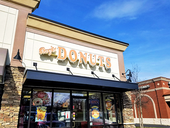 Sunshine bounces off Ray's Donuts' welcoming signage. The stone accents say "classy," but the donuts inside say "get in my belly!"