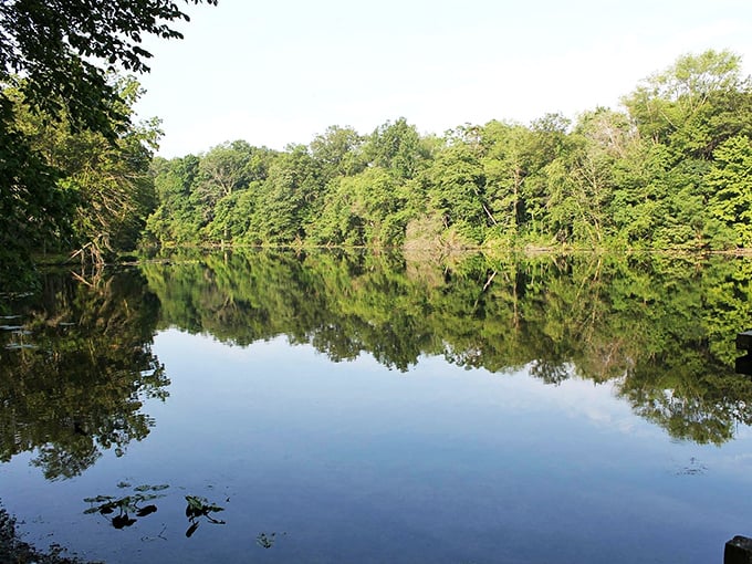 Glassy waters reflect moody skies&mdash;nature's version of a perfect mirror selfie without the awkward arm angle.