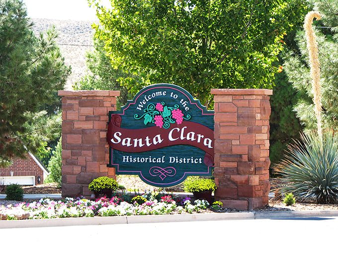 Red rock drama meets small-town budgets &ndash; Santa Clara's entrance sign promises both beauty and affordability.