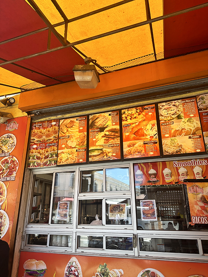 The menu board at Alley Dog reads like a United Nations of hot dog diplomacy &ndash; bringing global flavors together one bun at a time.