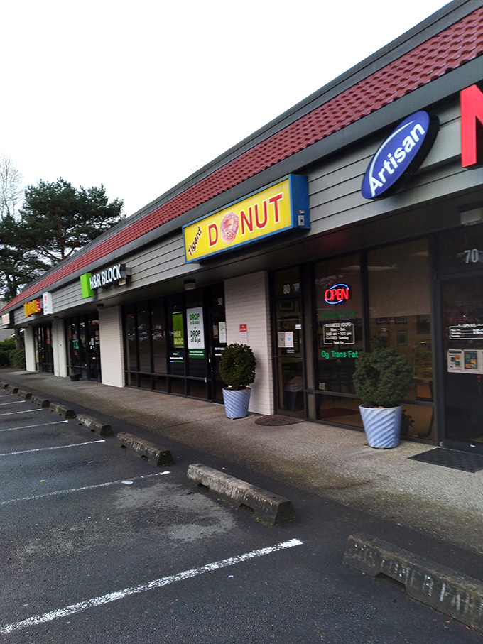 The humble yellow sign with that perfect donut illustration tells you everything you need to know. No frills, all flavor! 