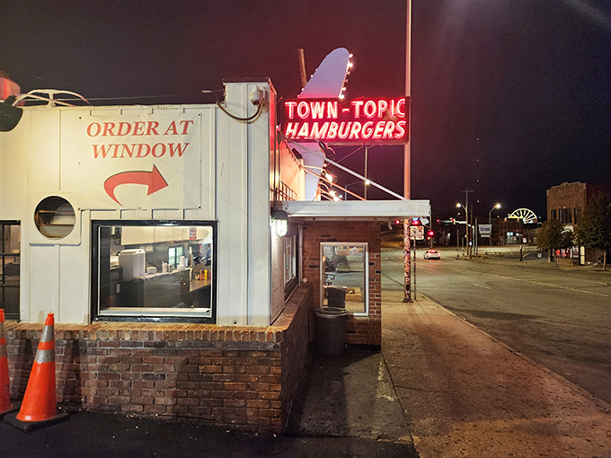 Night transforms Town Topic into a neon-lit burger sanctuary, beckoning hungry souls with the promise of hand-crafted satisfaction.