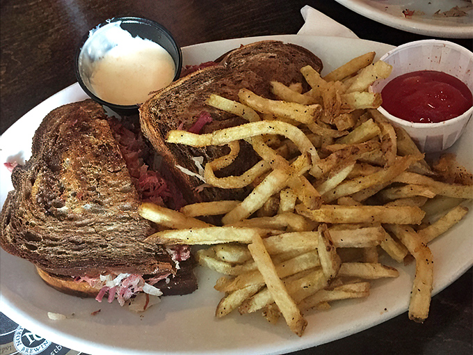 The cross-section reveals the truth &ndash; this isn't just a sandwich, it's an architectural marvel of perfectly layered corned beef.