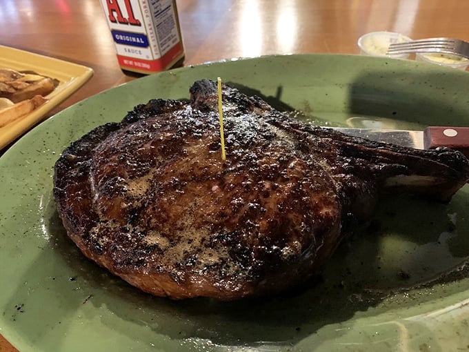 Twenty ounces of perfectly charred beef on a green plate&mdash;proof that sometimes the simplest presentation lets quality speak for itself.